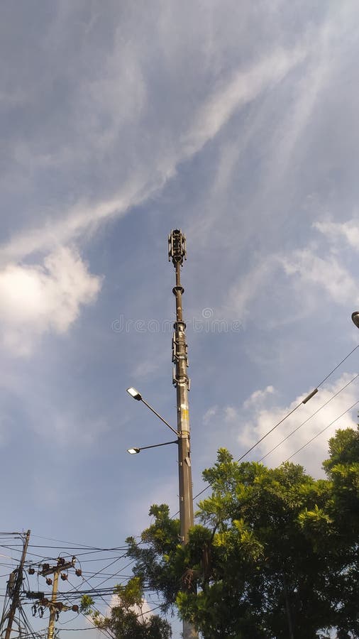 An Electric Tower and Some Street Lights Stock Photo - Image of tower ...