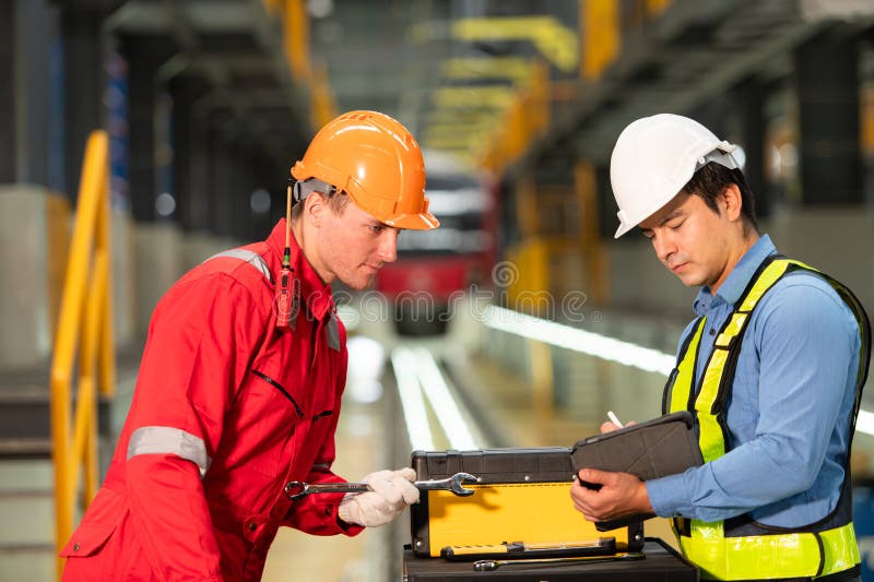 Electric Train Engineer and Technician Using Repair Tools of the ...