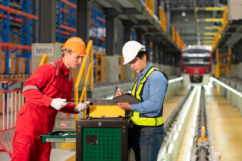 Electric Train Engineer and Technician Using Repair Tools of the ...