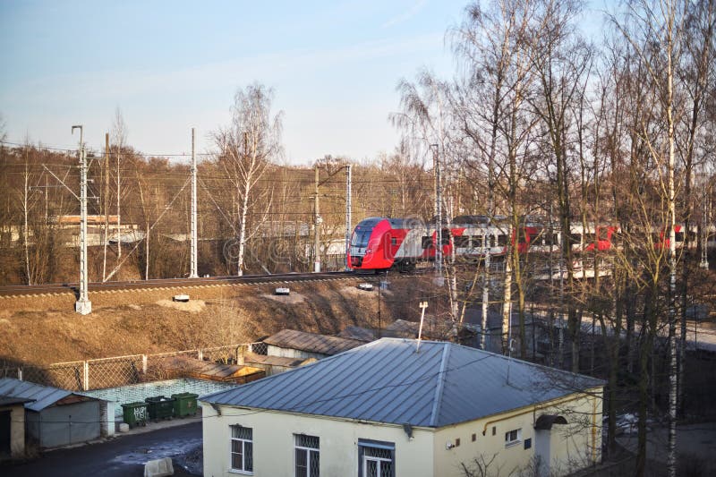 Electric Train Leaves the Autumn Forest in the Morning Stock Photo ...