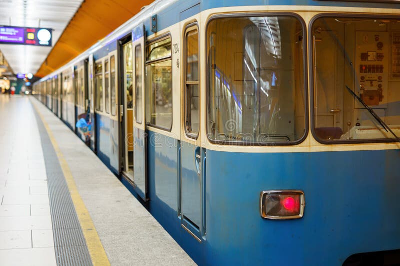 An Electric Train with Metro Passengers in an Underground Metro Station ...