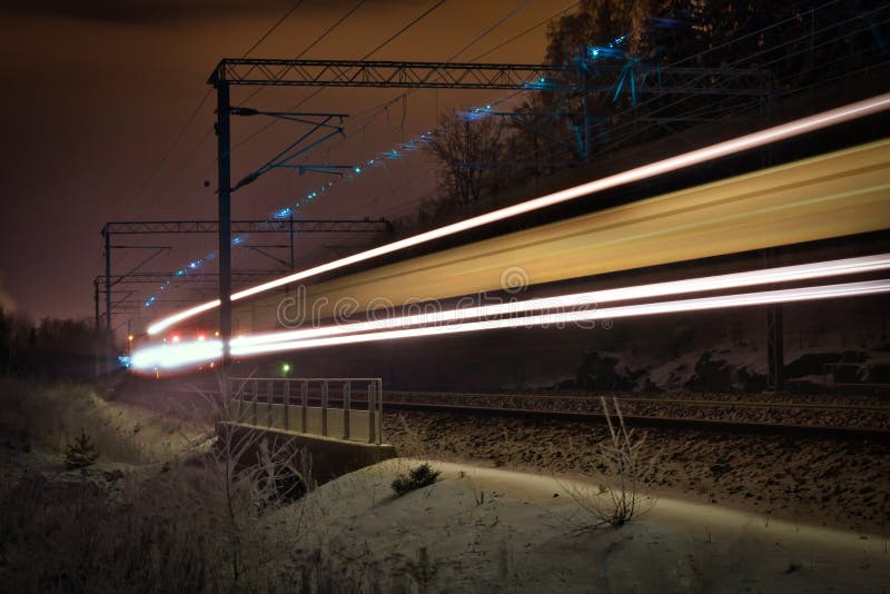 Electric train at night stock photo. Image of environment - 225864652