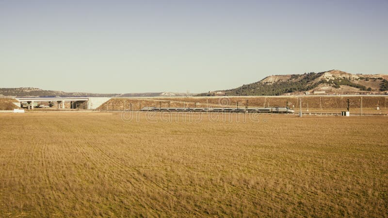 Electric Train Running in a Yellow Field Stock Photo - Image of outdoor ...
