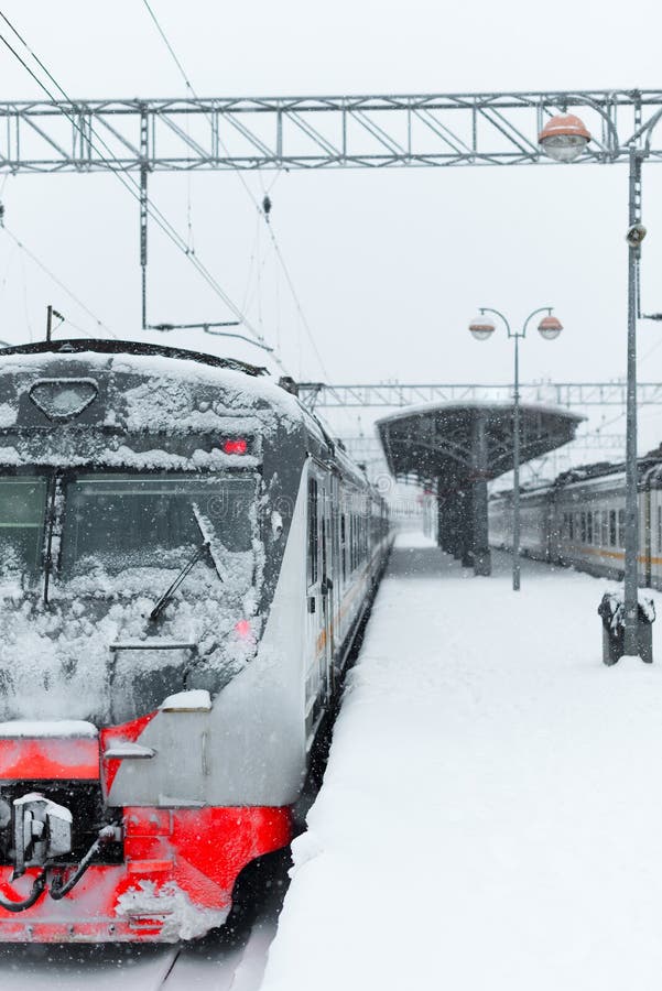 Electric Train in Snow in a Blizzard on an Empty Platform Stock Photo ...