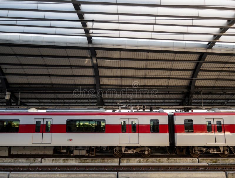 The Electric Train Stops To Pick Up Passengers at a Suburban Station ...
