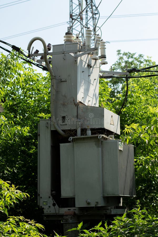 Electric Transformer among Trees in a Summer Stock Image - Image of ...