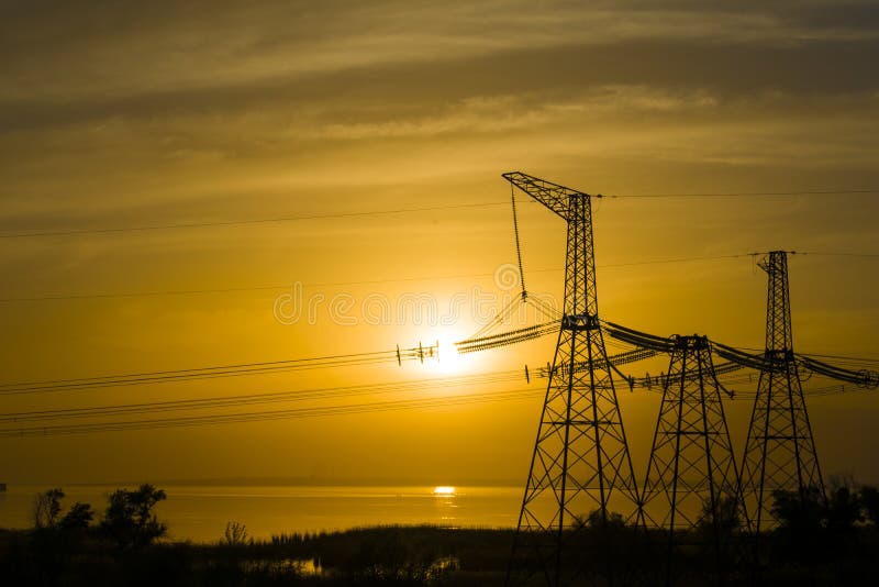 Electric Transmission Line on a Colorful Sunset Stock Photo - Image of ...