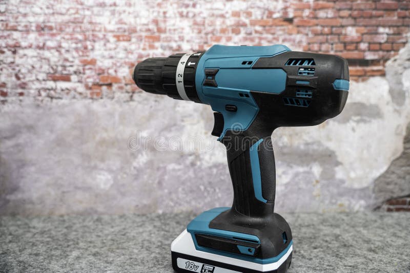 Electric Turquoise Power Drill Against a Brick Wall Stock Photo - Image ...