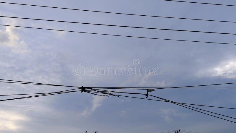 Electric Utility Lines in the Sky with Clouds and Breaking Points Stock ...