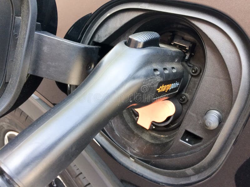 Electric Vehicle Charging Handle Editorial Photo - Image of blue, leaf ...