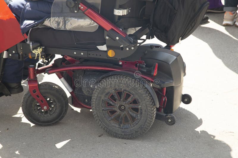An Electric Wheelchair User Drives Around the City Stock Image - Image ...