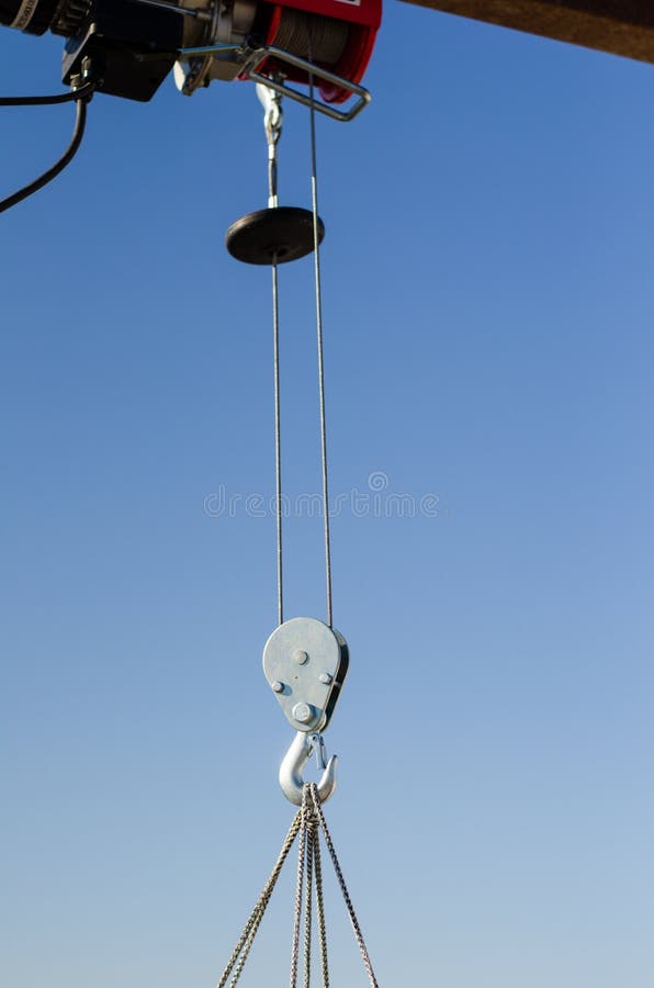 Electric Winch Hook Lifts Load on Cables at the Construction Site Stock ...