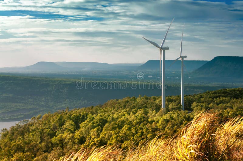 Electric Wind Turbines Over the Dam with the Mountain Stock Image ...