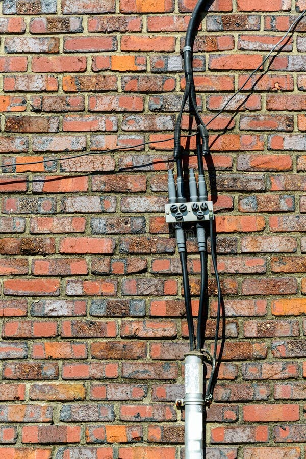 Electric Wire on Brick Wall Stock Image - Image of electrical, building ...