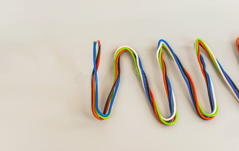 Electric Wires of Different Colors in Curved Form on a Gray Background ...