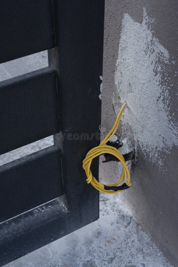 3 Electric Wires Laying Out from the Concrete Wall Stock Photo - Image ...