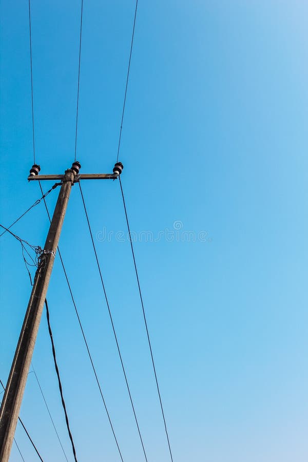 Electric Wires and Poles Against a Clear Sky Background Stock Image ...