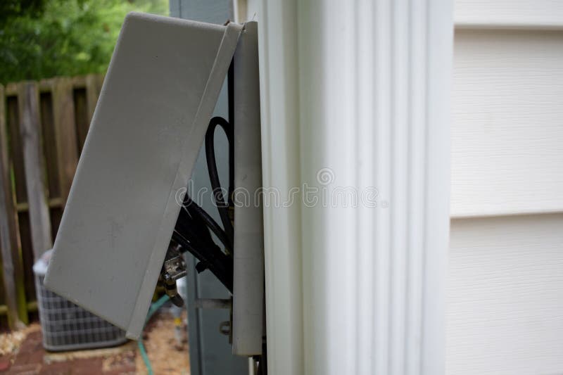 An Electrical Box Outside of a Home is Open Stock Photo - Image of ...