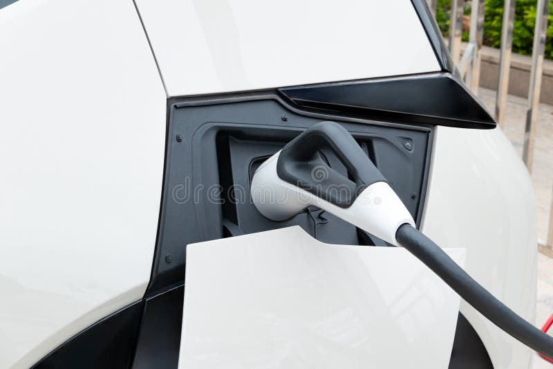 An Electrical Car Being Charged at Horizontal Composition Stock Photo ...