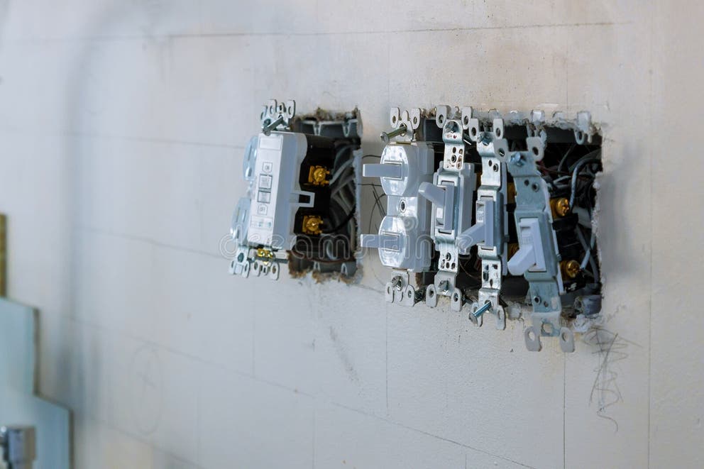Electrical Circuit Breakers Arranged on a Wall Inside a Utility Room ...