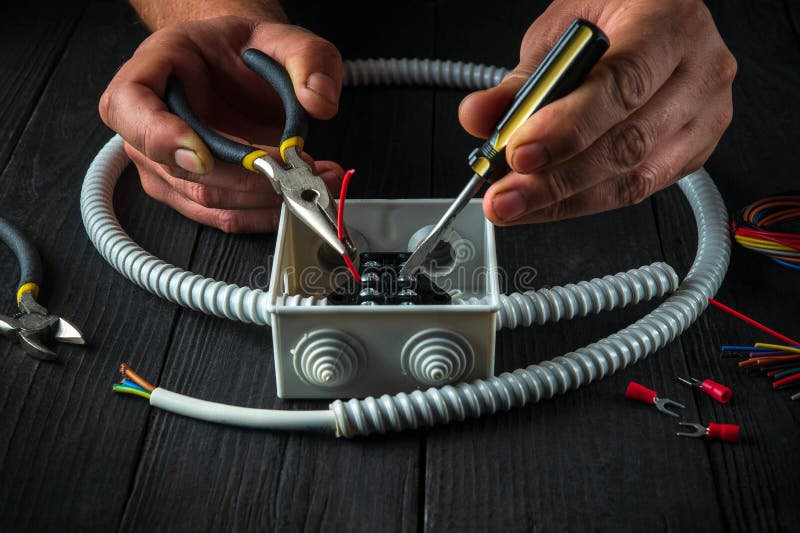 Installing Cable or Wire To a Junction Box. Electrical Connection in ...