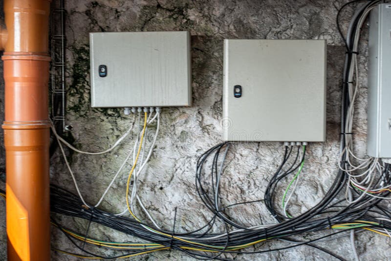 Electrical Control Boxes with Cables Mounted on an Old Stone Wall Next ...