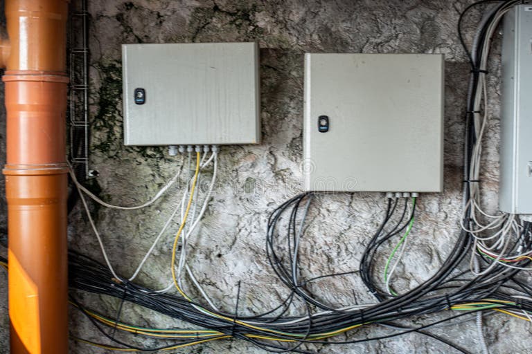 Electrical Control Boxes with Cables Mounted on an Old Stone Wall Next ...