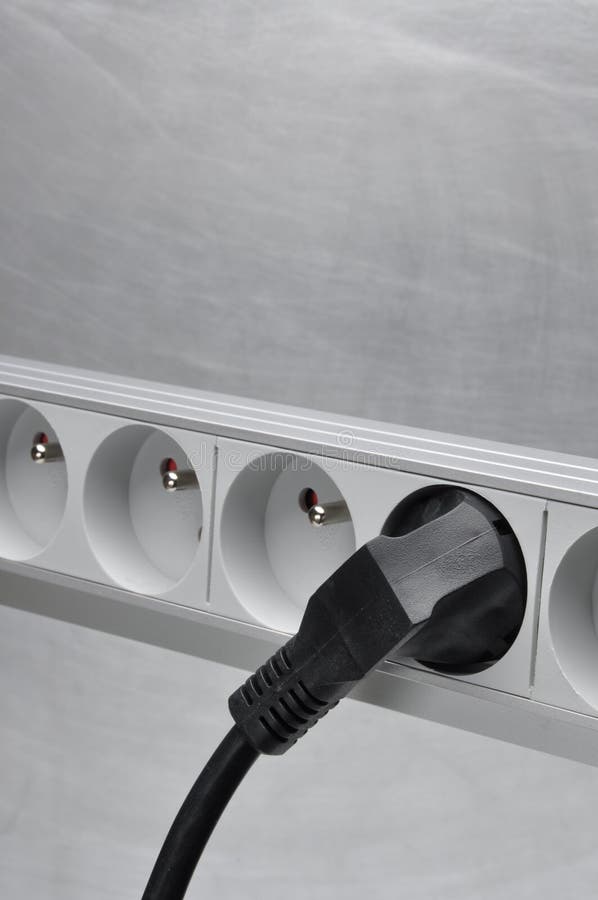 Electrical Cord with Power Strip on Grey Metal Background Stock Image ...