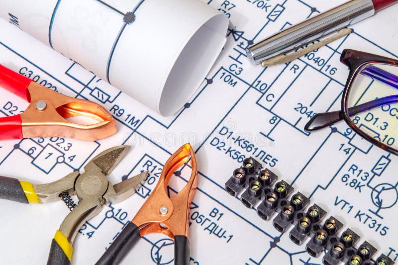 Electrical Diagrams and Metal Pincers Building a House Concept for ...