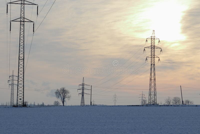 Electrical Distribution Network in Winter Landscape. High Voltage Pole ...