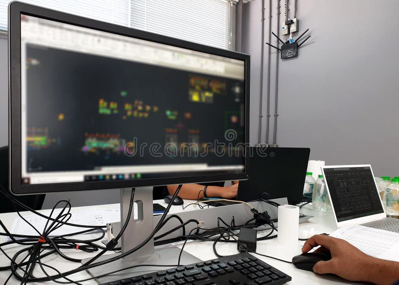 Electrical Draftsman Working on the Computer Monitor with Typing ...