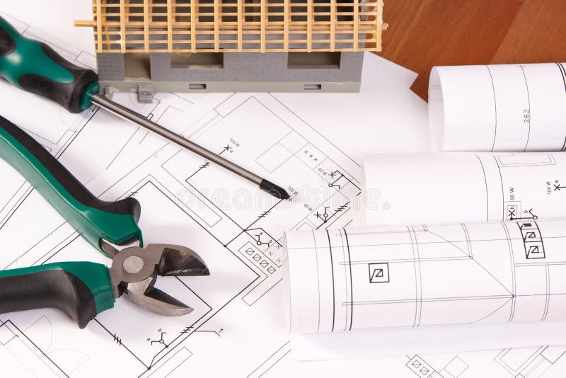 Electrical Drawings, Work Tools and House Under Construction Lying on ...