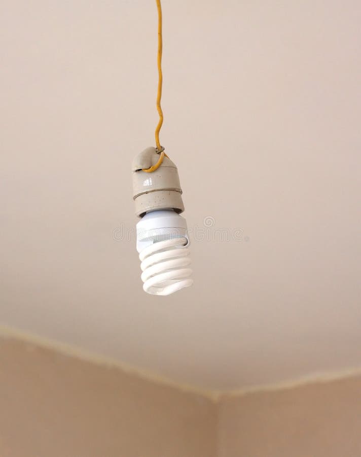 Electrical Energy Saving Light Bulb in White Chuck Hanging Stock Image ...