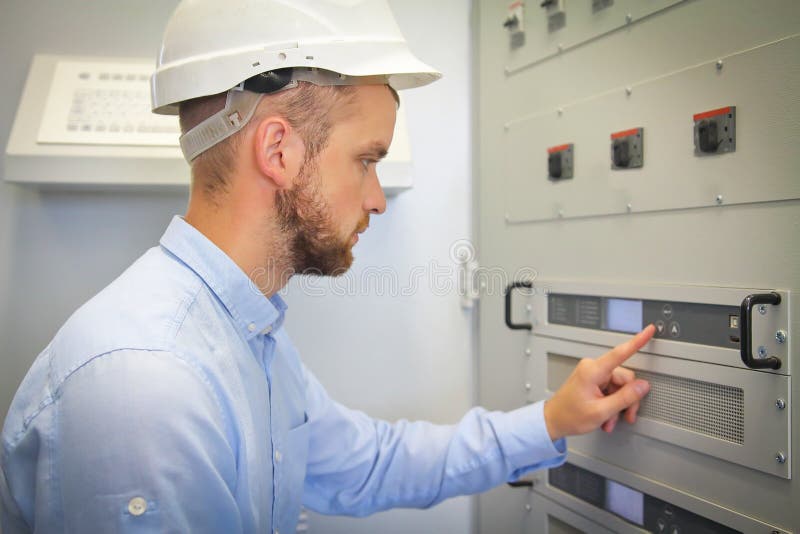 Electrical Engineer for Automation Configures Industrial Controller ...
