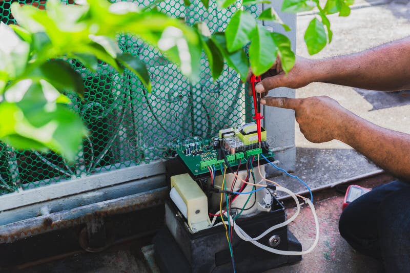 Electrical Engineer Checking Circuit Board at Home. Stock Photo - Image ...