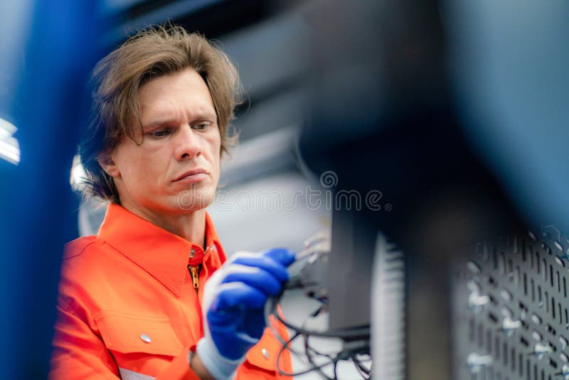 Electrical Engineer Checking Power Distribution Cabinet in the Control ...