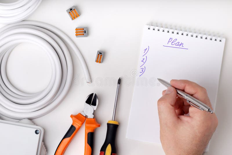 Electrical Engineer at Construction Site. Electrician Write Plan of ...