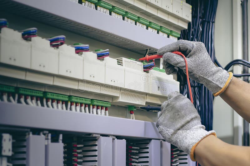An Electrical Engineer is Inspecting the Operation of an Electrical ...