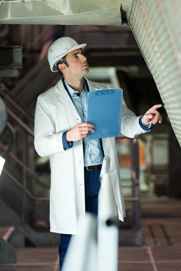 Electrical Engineer Inspecting Panel Stock Photo - Image of plant ...