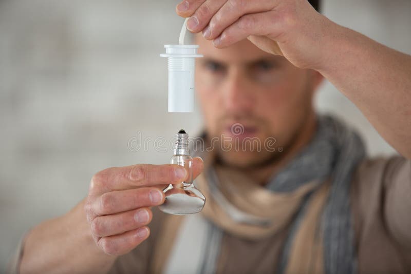 Electrical Engineer Installing Ceiling Lamps in Hallway Stock Photo ...