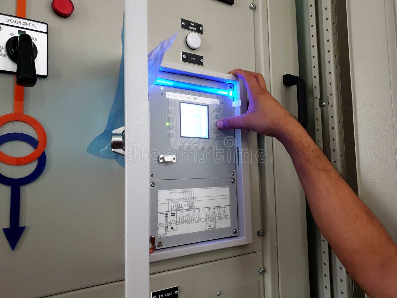 Electrical Engineer Rechecks the Auto Voltage Regulator Setting before ...