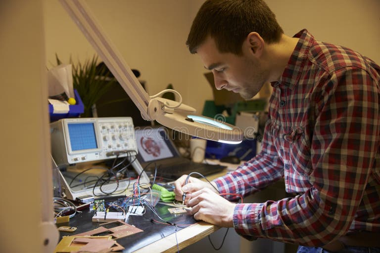 Electrical Engineer Soldering Circuit Board at Work Bench Stock Image ...