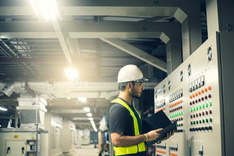 Electrical Engineer Team Working Front Control Panel. Stock Photo ...