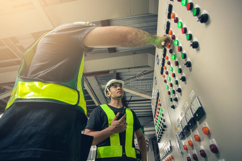 Electrical Engineer Team Working Front Control Panel. Stock Image ...