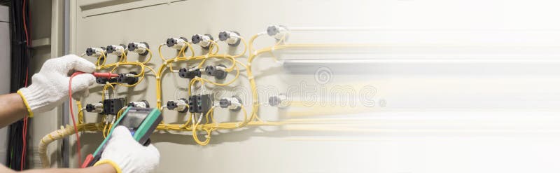 Engineer Tests Industrial Electrical Circuits with a Multimeter in the ...