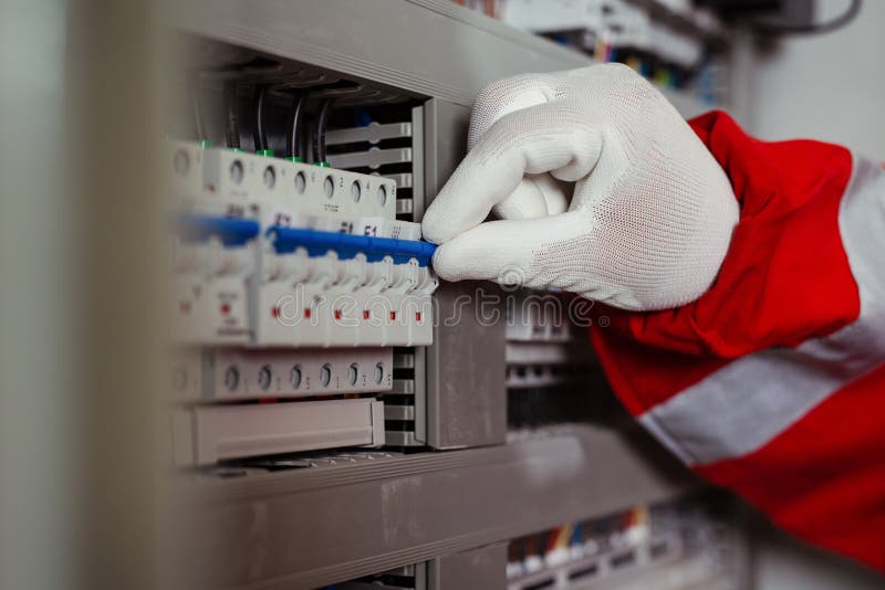 Electrical Engineer Turning on the Fuse Box Stock Photo - Image of ...