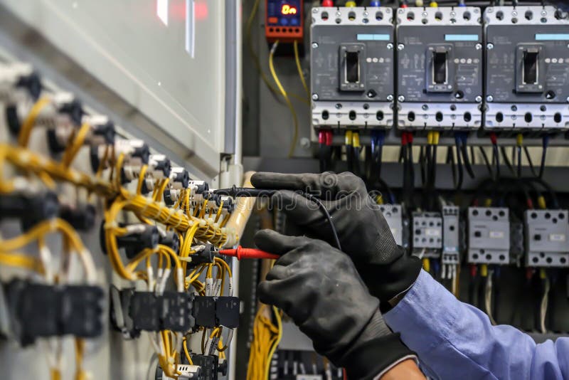 Electrical Engineer Using Digital Multi-meter Measuring Equipment To ...