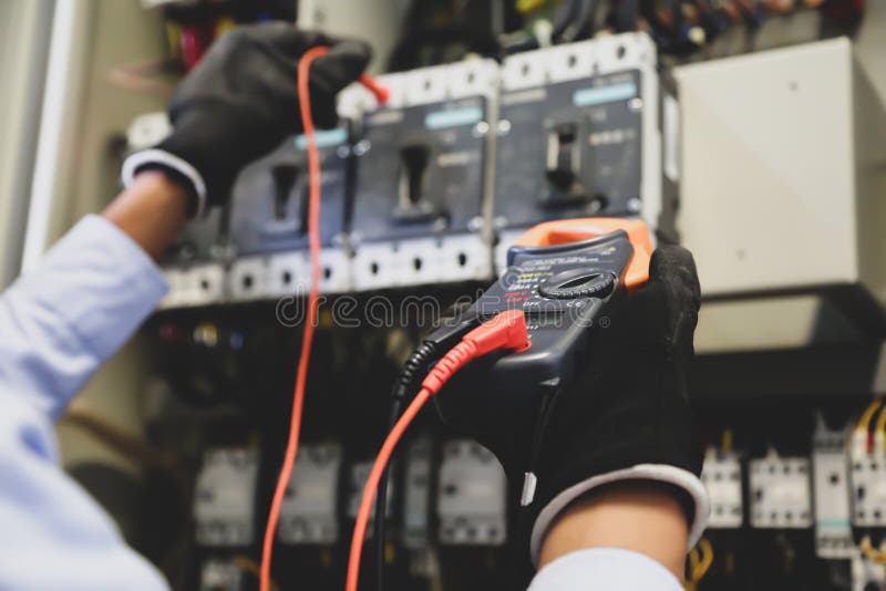 Electrical Engineer Using Digital Multi-meter To Check Current Voltage ...