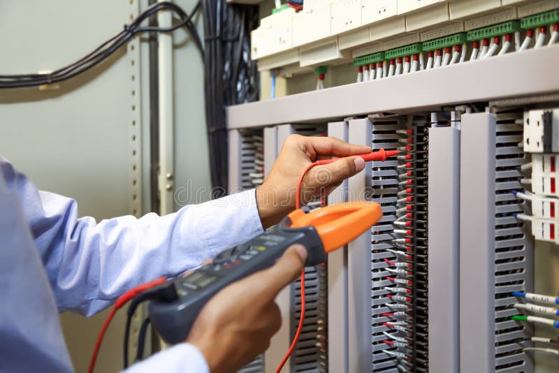 Electrical Engineer Using Digital Multi-meter To Check Current Voltage ...