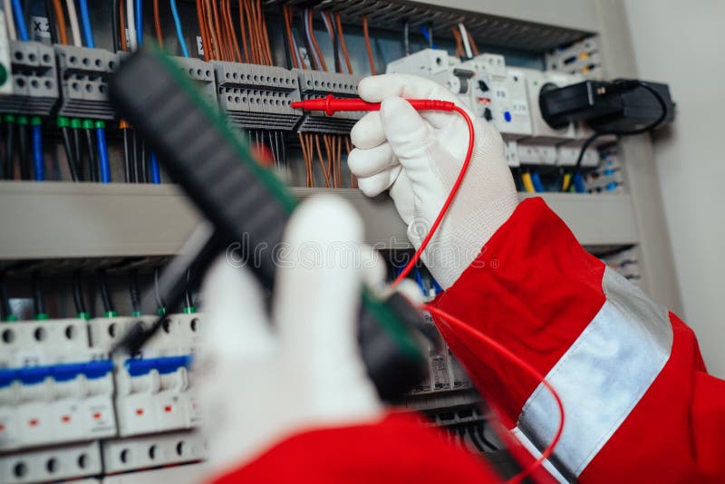 Electrical Engineer Using Digital Multimeter Measuring Equipment To ...